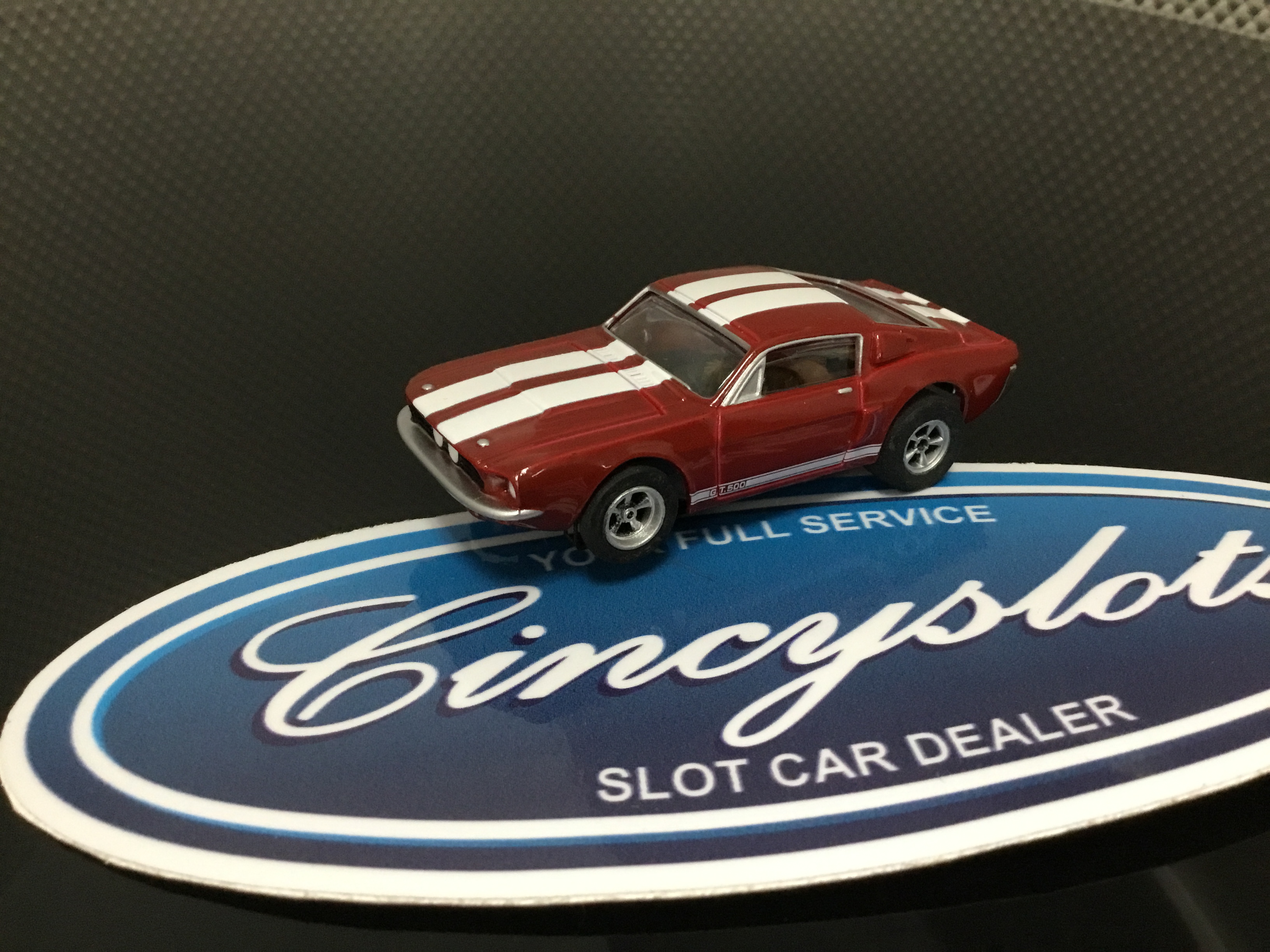 AFX ORIGINAL CHASSIS WITH A NEW AUTOWORLD MUSTANG BODY.