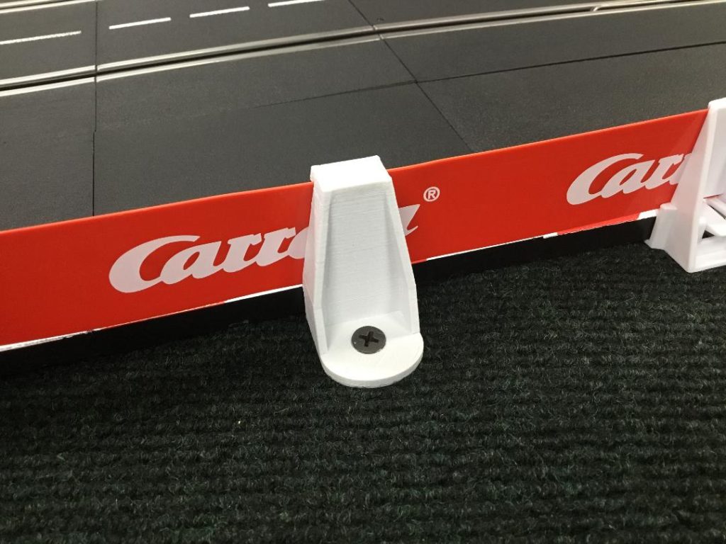 Custom 3D Printed Guardrail Clips for Carrera Slot Car Tracks.