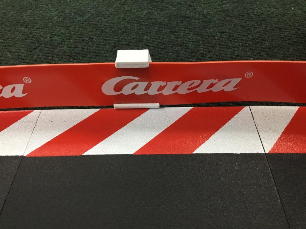 Custom 3D Printed Guardrail Clips for Carrera Slot Car Tracks.